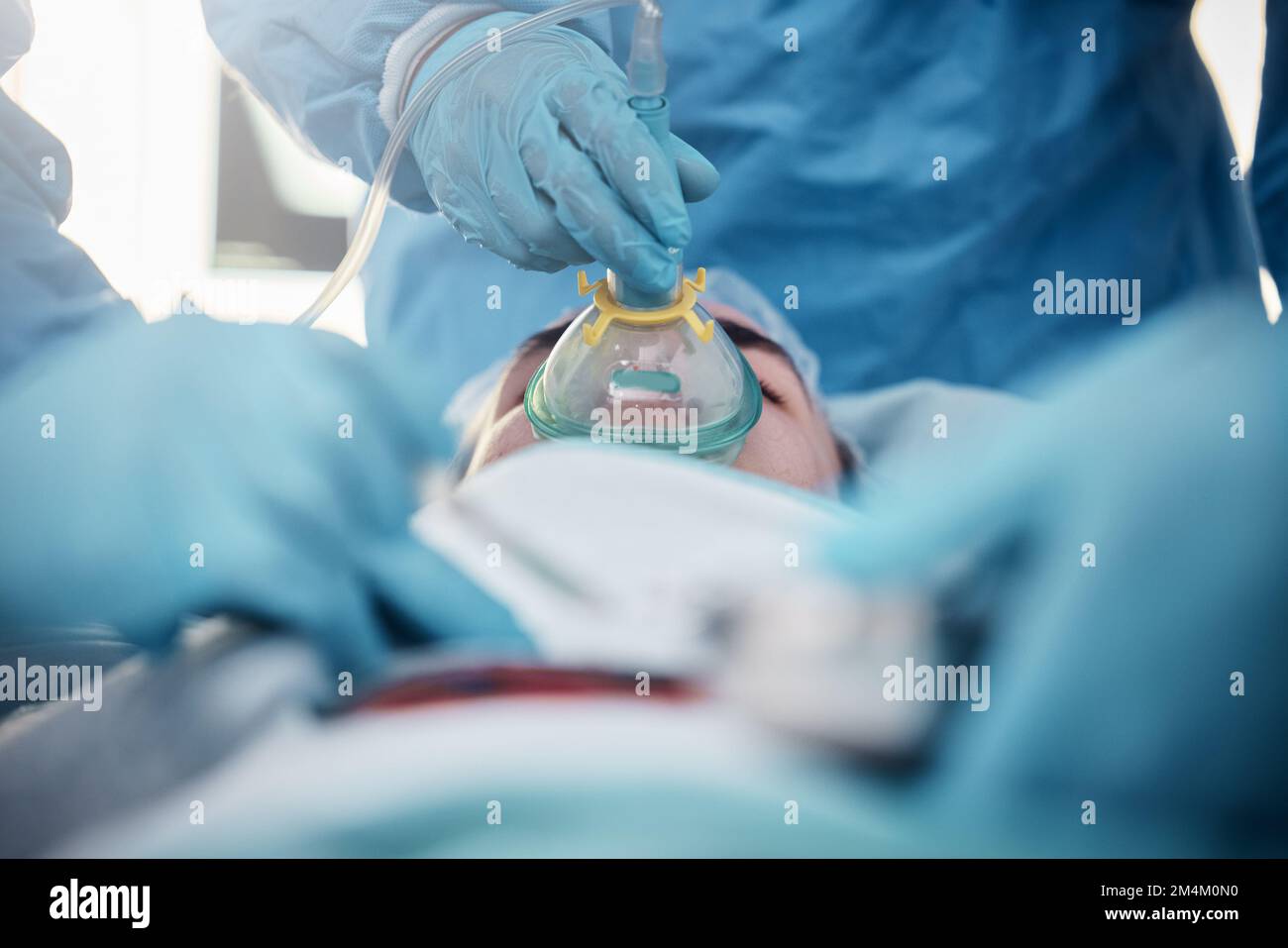 Doctors, surgery and oxygen mask with a medicine team in scrubs ...