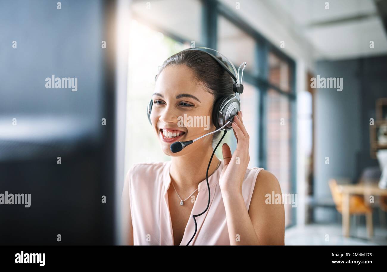 Helping others comes naturally. an attractive young woman working in a ...