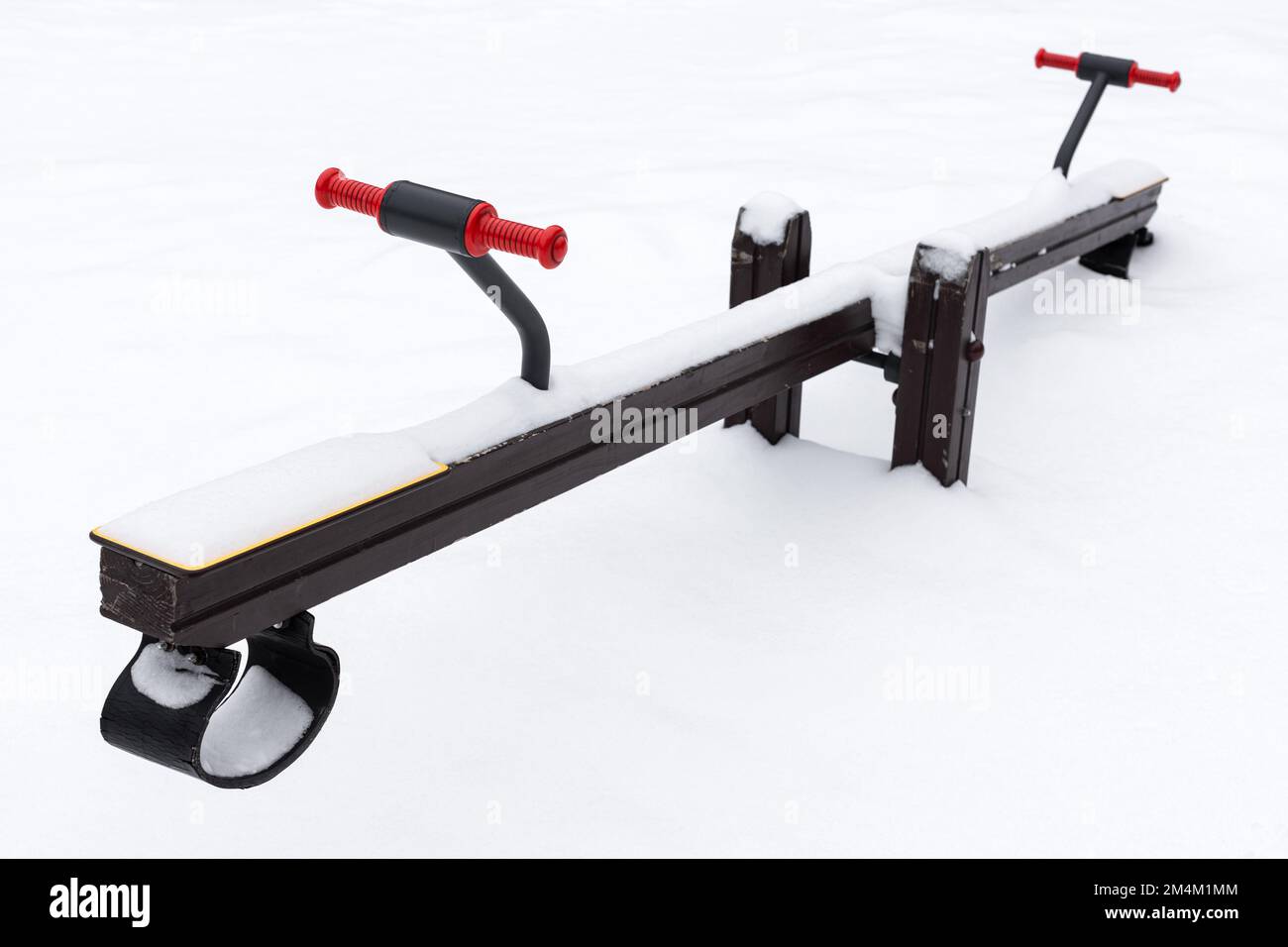 children's swing covered with snow in winter. snow covered swing Stock ...