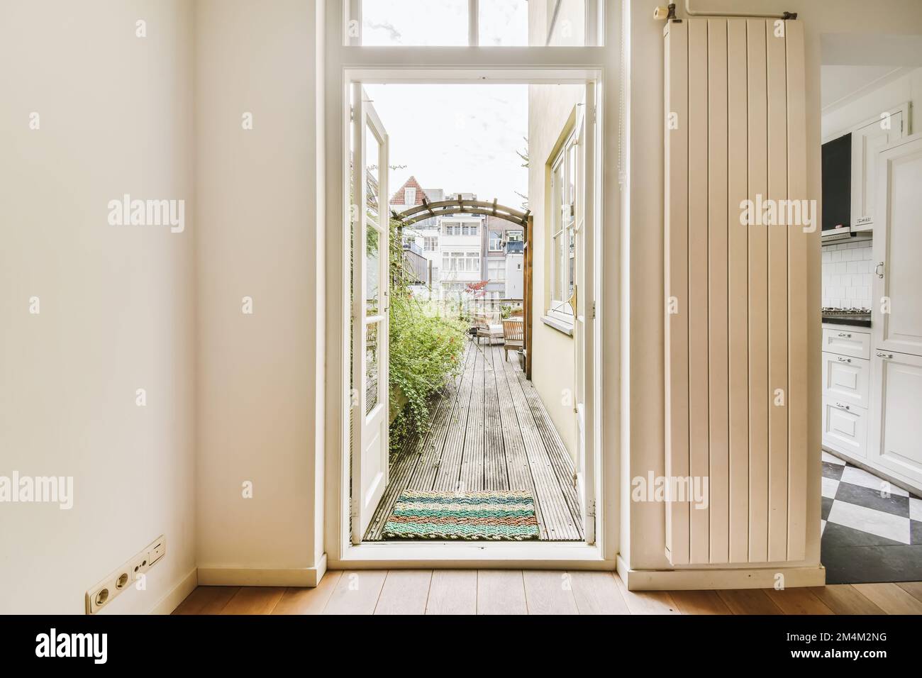 an open door leading to the kitchen and dining area in a house with ...