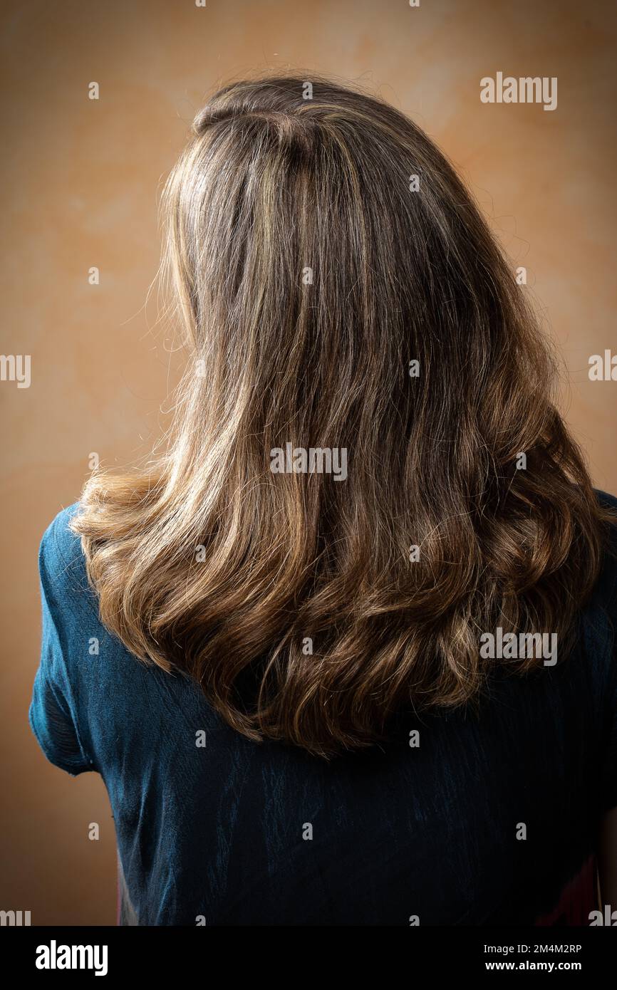 Dye on the hair of a middle-aged woman who still looks youthful ...