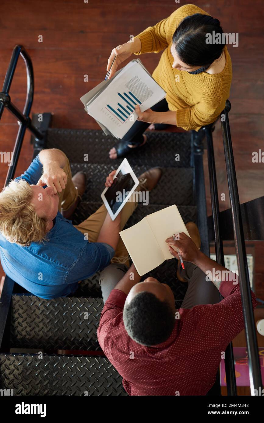 Coming up with ideas to push up the numbers. a group of creative ...