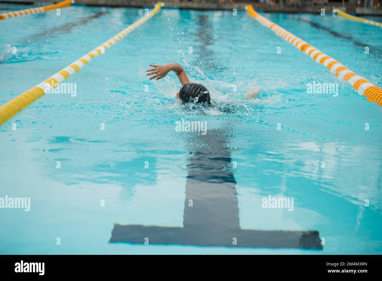 A person swimming in the pool lane line Stock Photo - Alamy