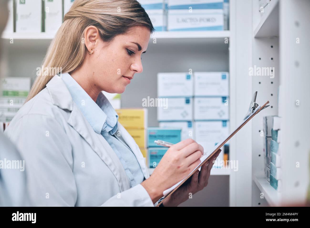 Pharmacist, writing or woman with checklist for medicine stock or ...