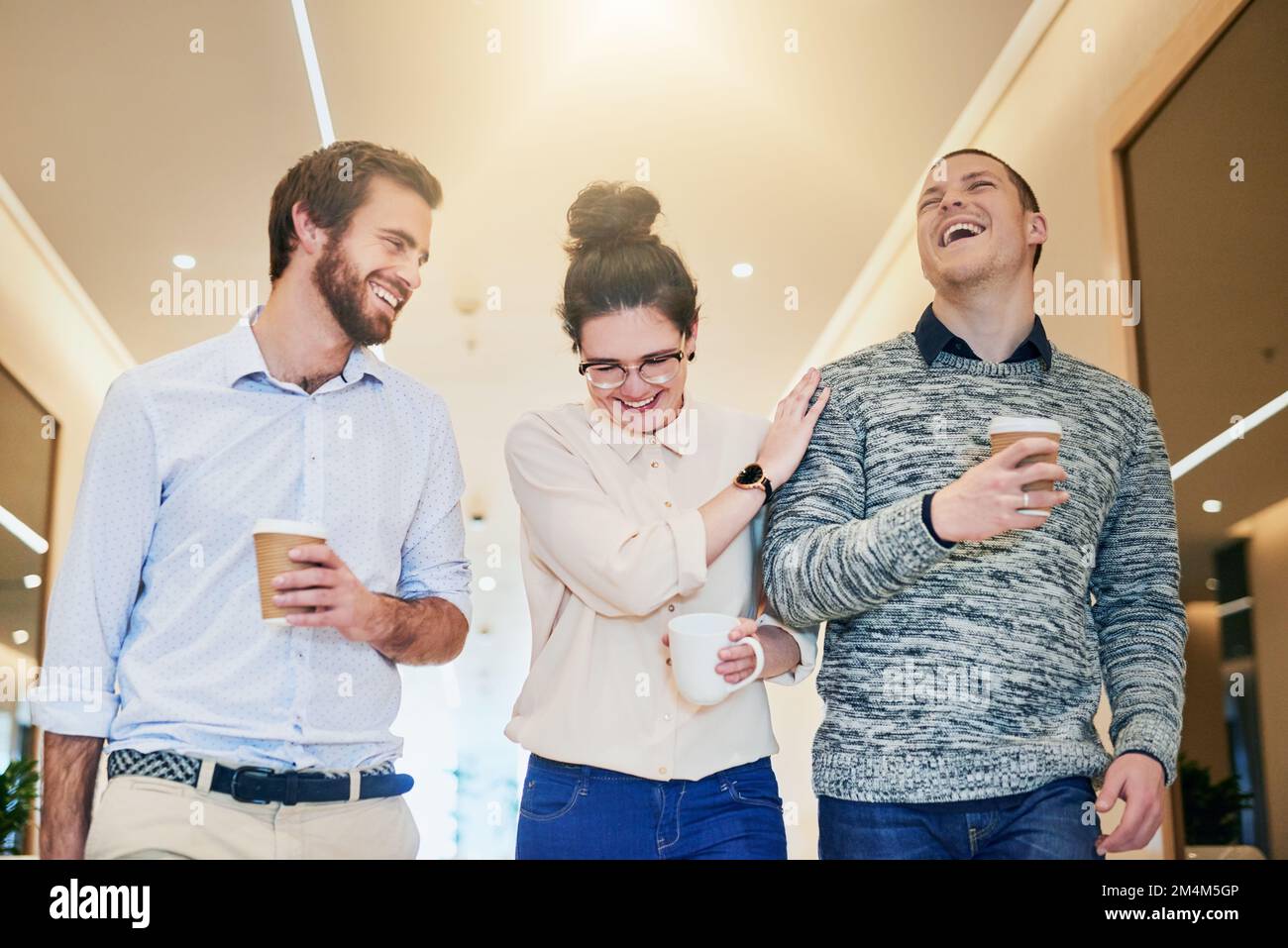 Coffee keeps us going throughout the day. a group of young ...