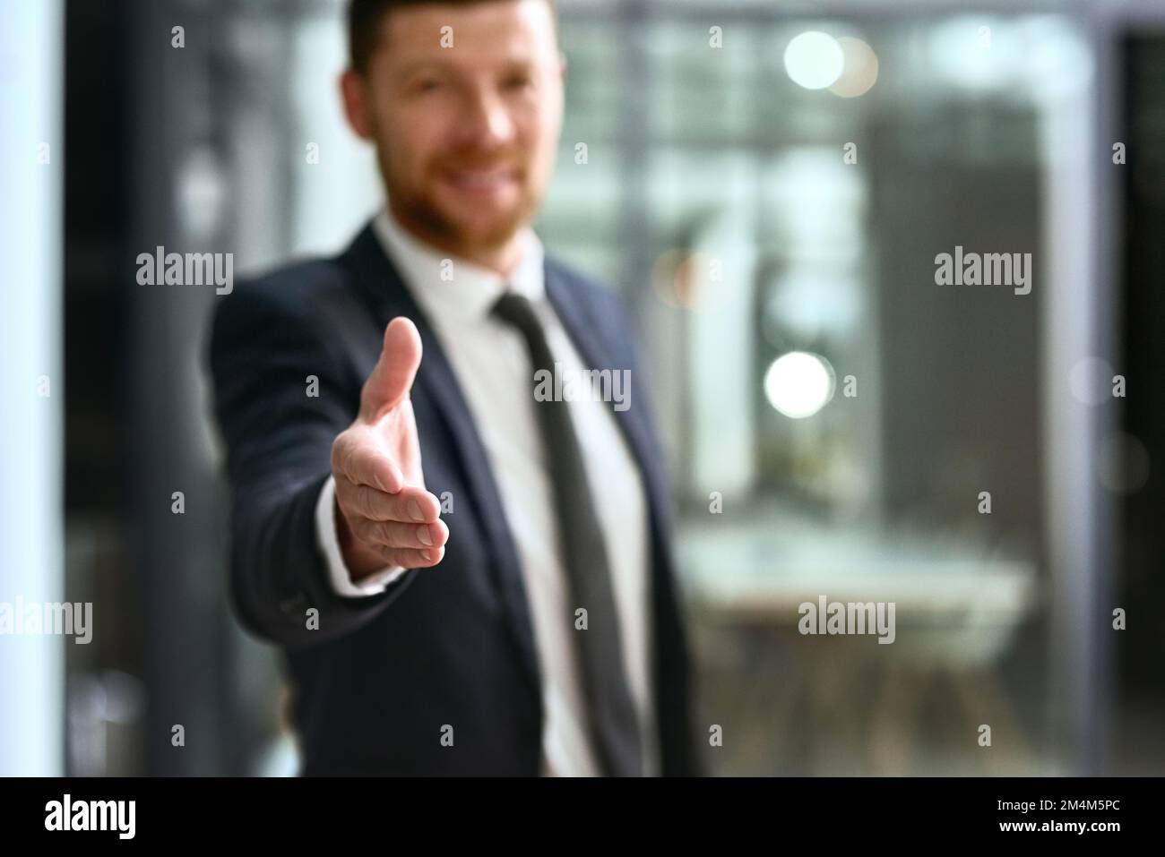 Your business is welcome here. a businessman extending his arm for a ...