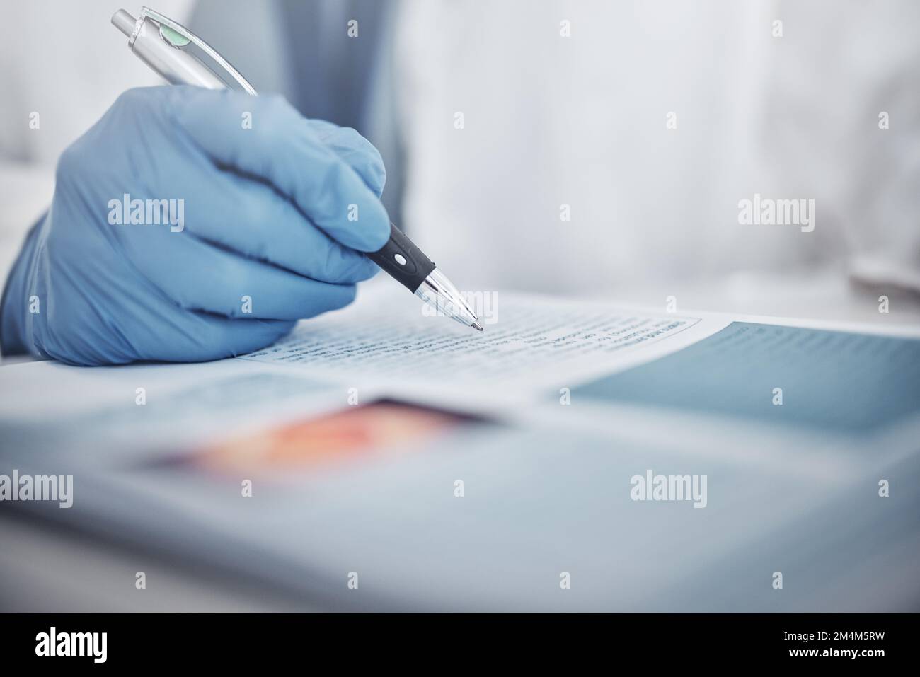 Scientist, hands or laboratory documents writing in medical research ...