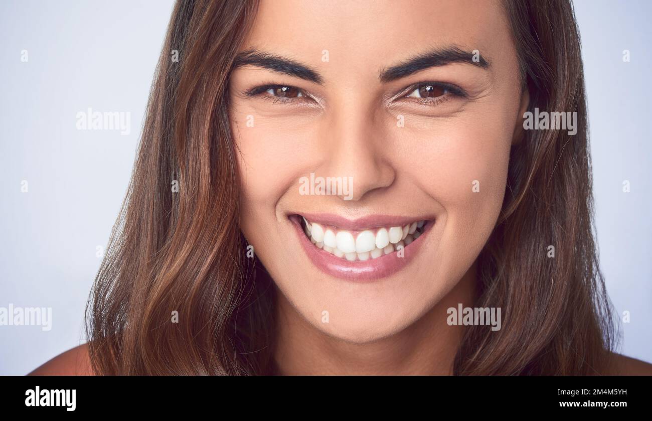 Even more beautiful up close. Studio shot of a beautiful young woman ...