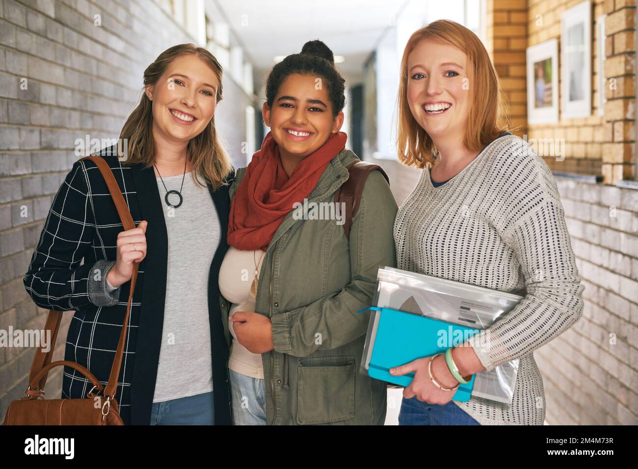 The it clique on campus. Portrait of three attractive young female ...