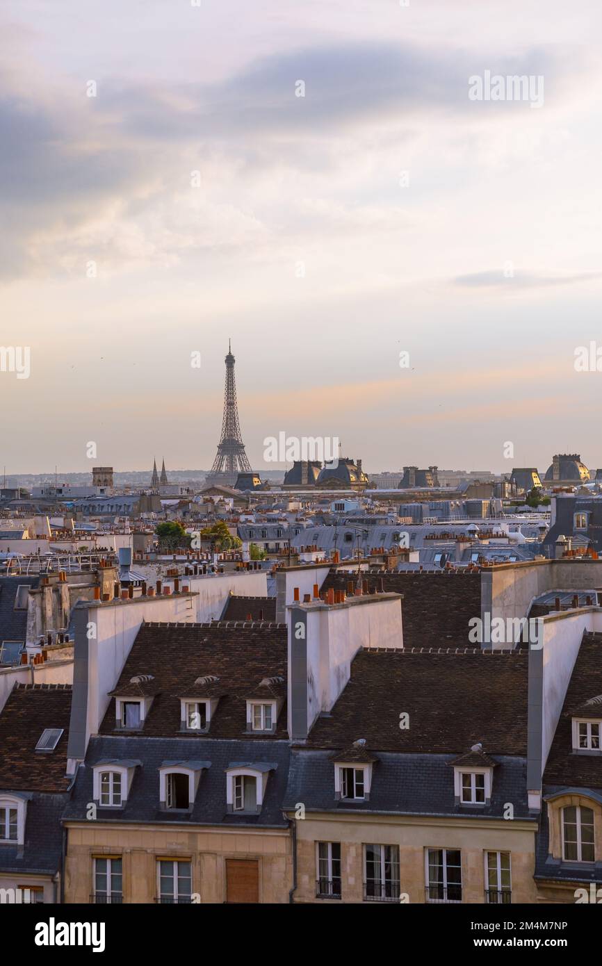 City day view of Parisian rooftops and Eiffel Tower. Famous landmark ...