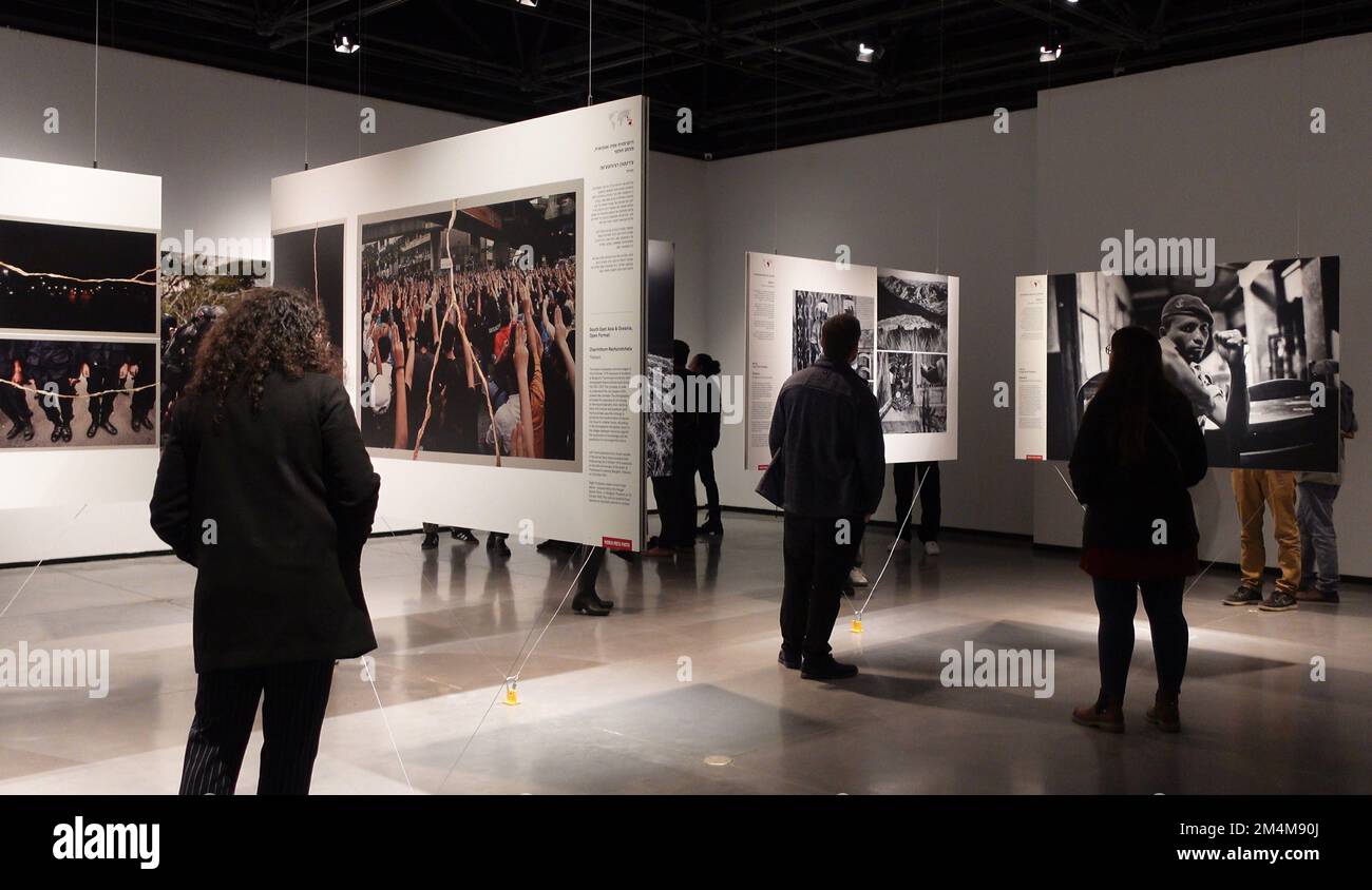 Visitors view winning pictures taken by various photojournalists from ...