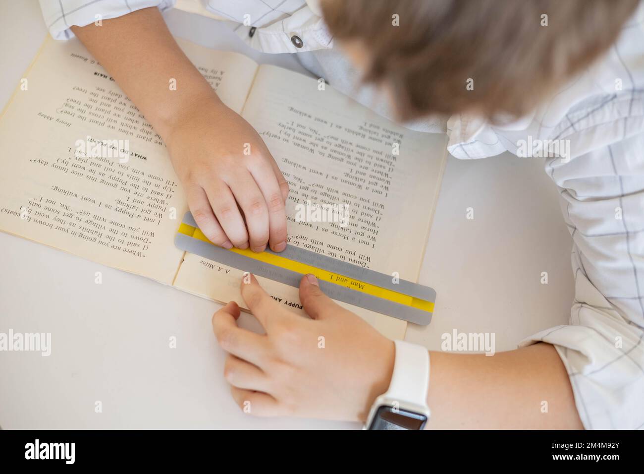 Khabarovsk, Russia, October 28, 2022. Dyslexic child reading book ...