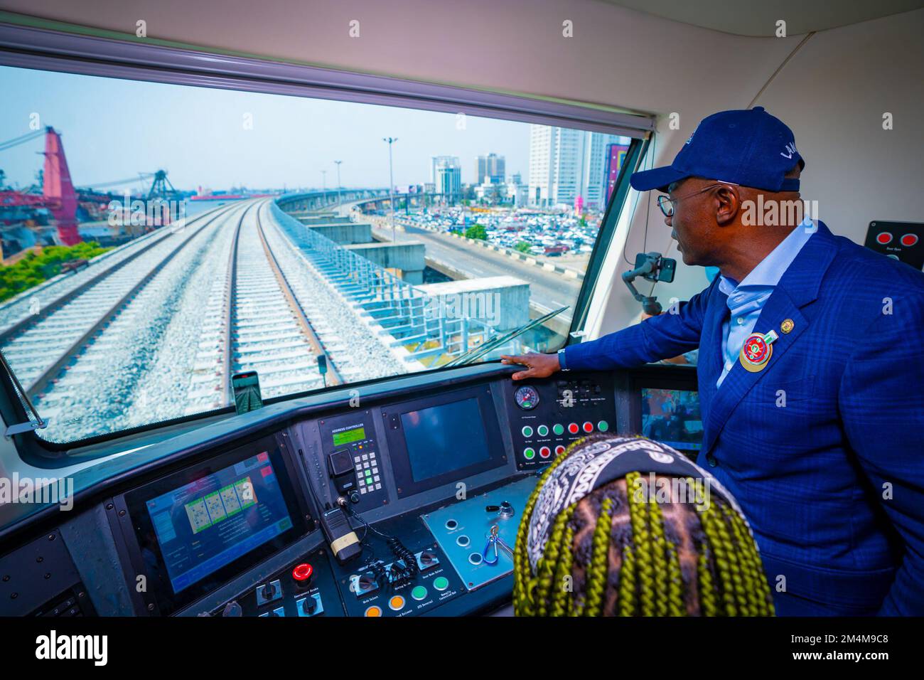 Lagos, Nigeria. 21st Dec, 2022. Invited guests take a test ride during ...