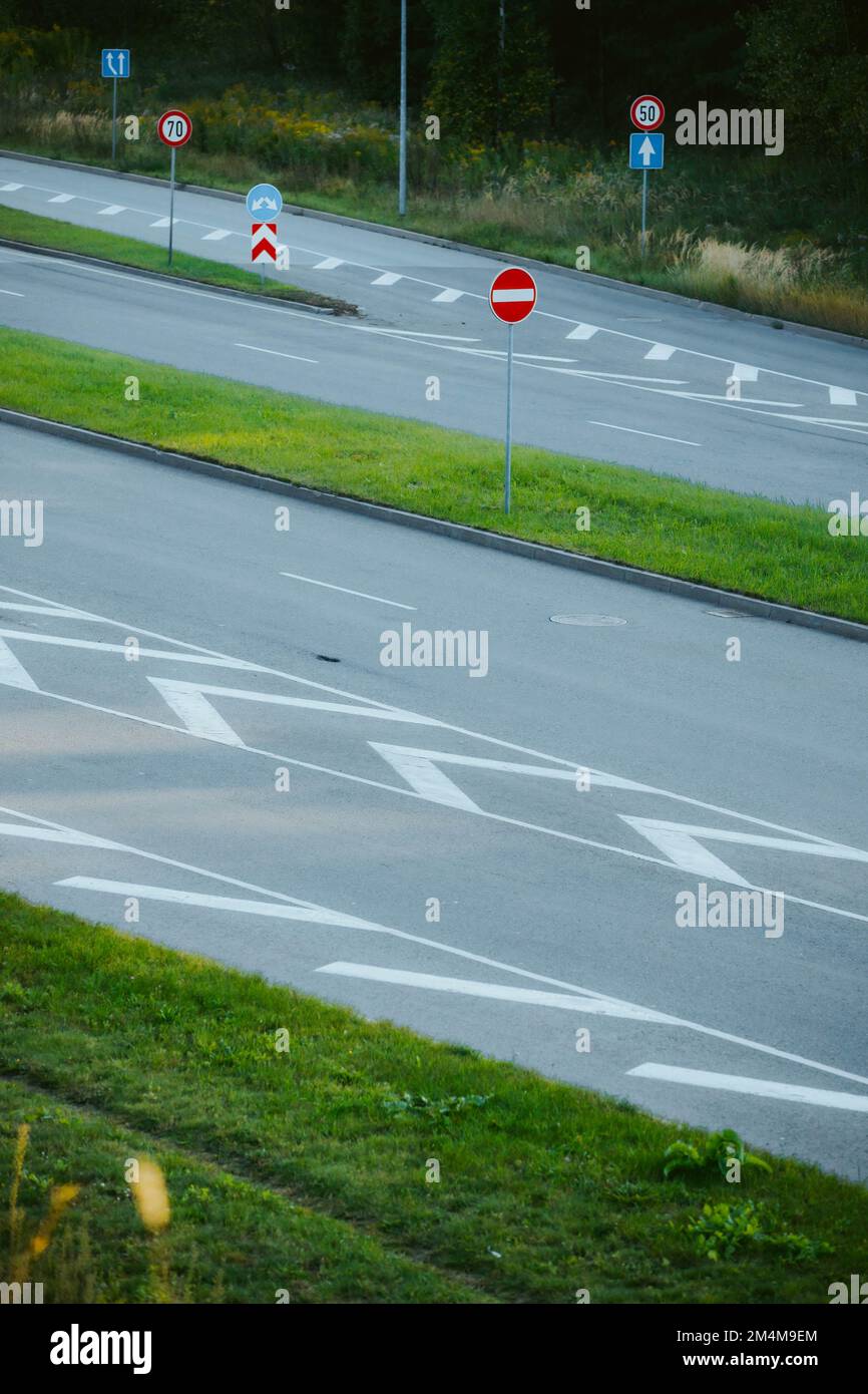 A vertical of a highway, asphalt road with road signs and road markings ...