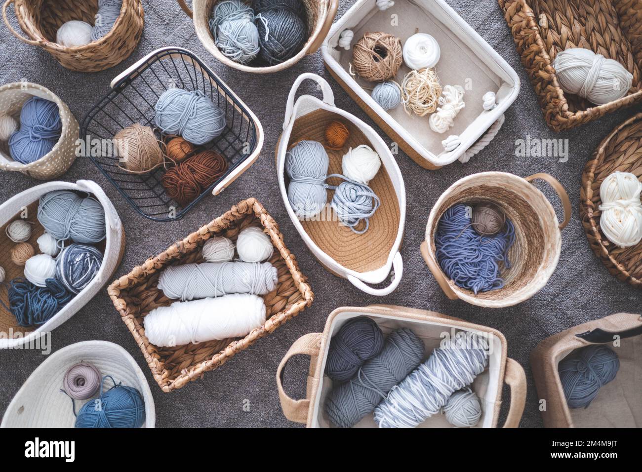 Many baskets made of natural eco-friendly materials. Yarn for knitting ...