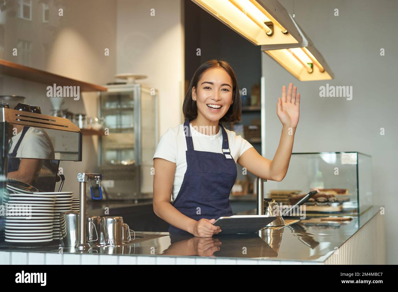 Asian cafe owner worker behind counter hi-res stock photography and ...