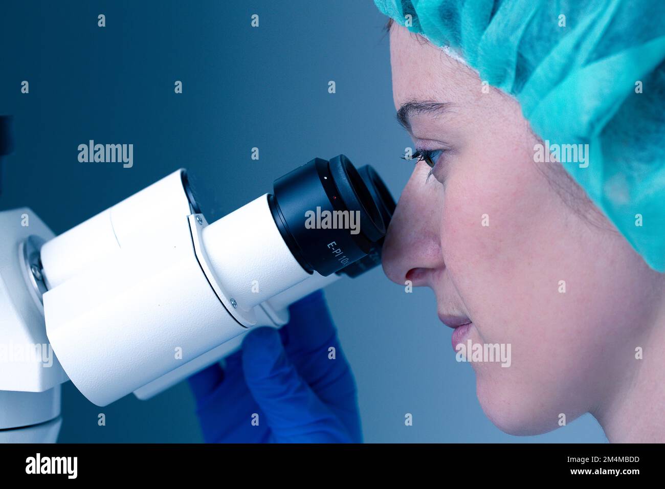 Closeup of a university researcher who is observing biological samples ...
