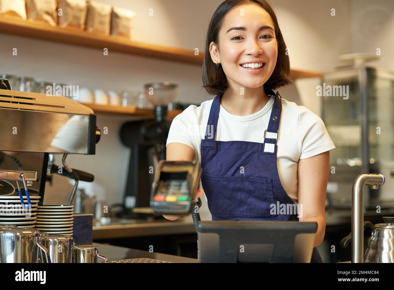 Small business and people. Smiling asian woman barista, working in cafe ...