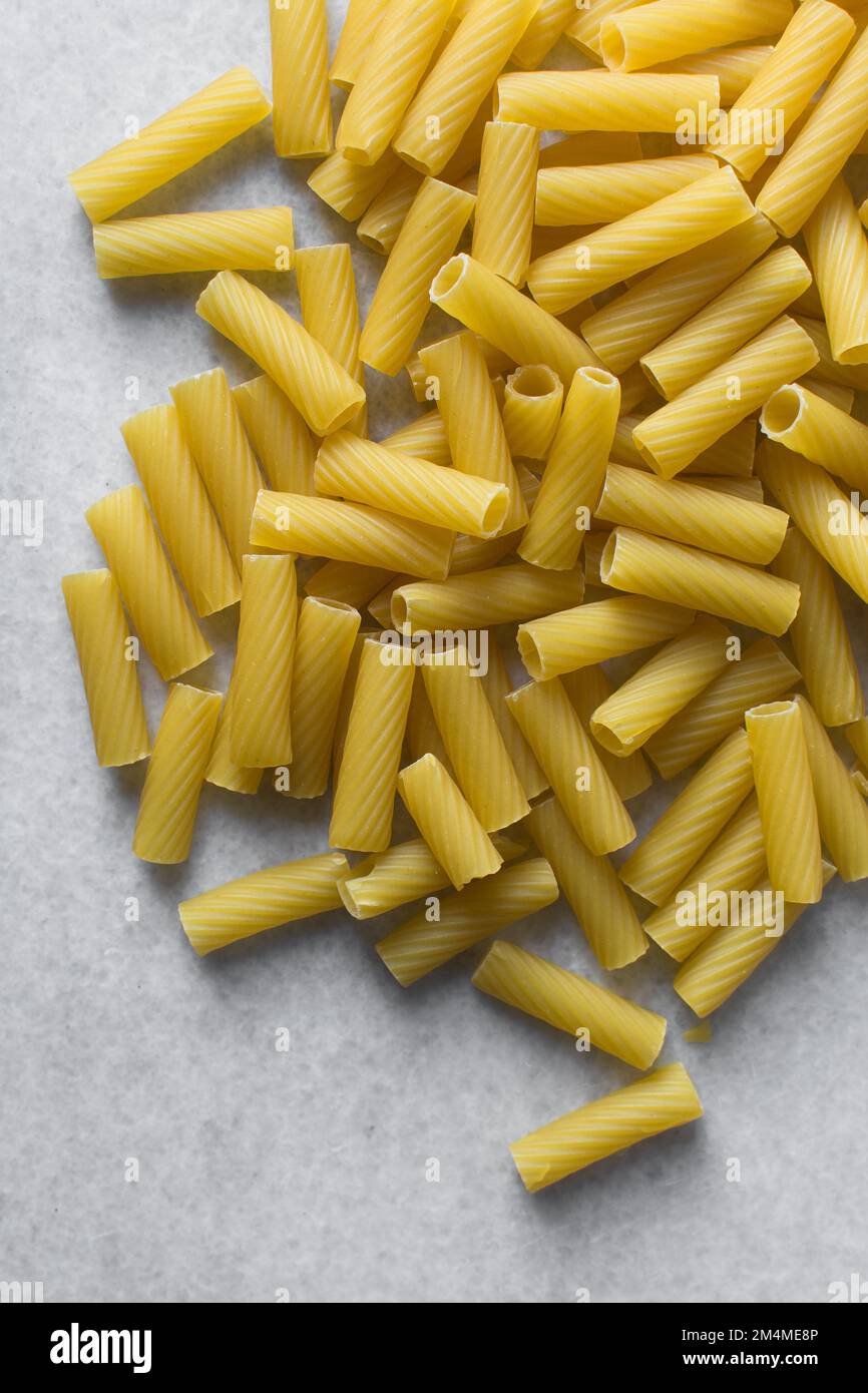 Flat lat of uncooked tortiglioni pasta shells, top view of tortiglioni ...