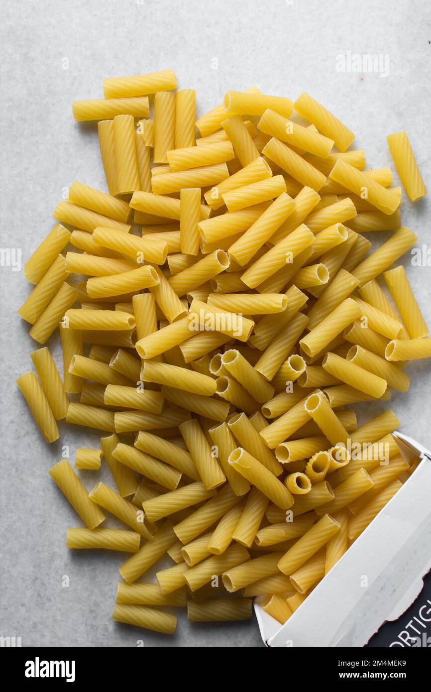 Flat lat of uncooked tortiglioni pasta shells, top view of tortiglioni ...