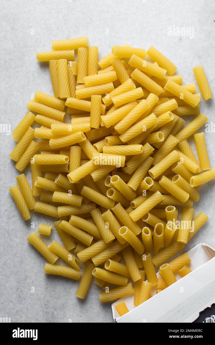 Flat lat of uncooked tortiglioni pasta shells, top view of tortiglioni ...