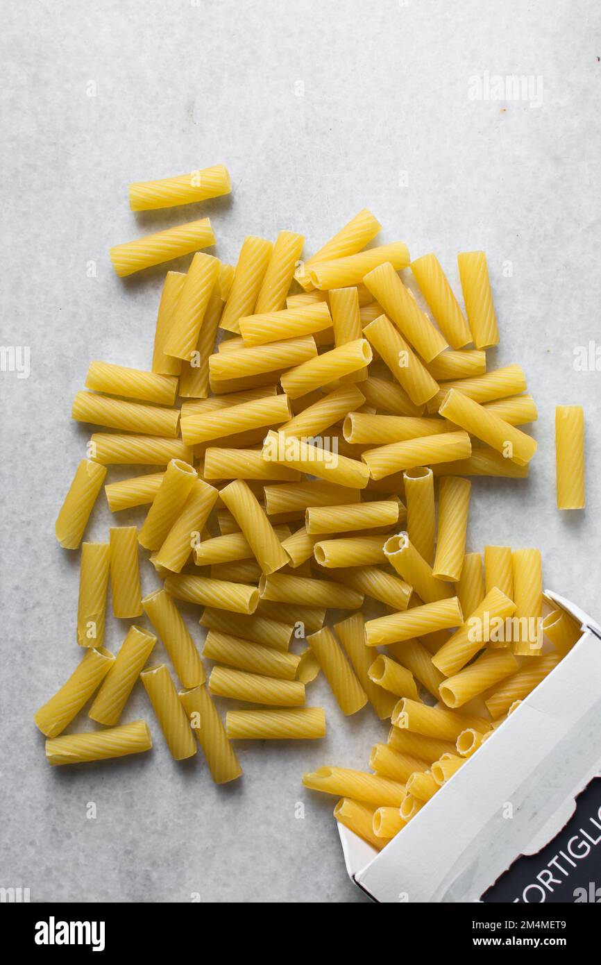 Flat lat of uncooked tortiglioni pasta shells, top view of tortiglioni ...
