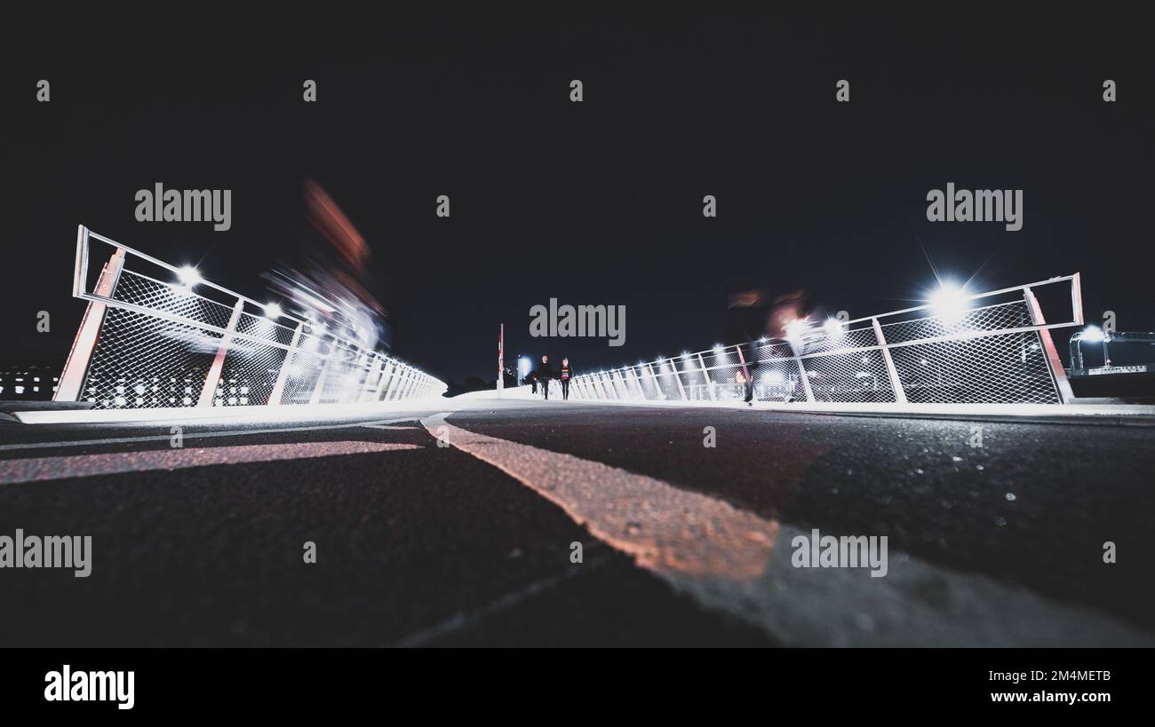illuminated pedestrian bridge at night Stock Photo - Alamy