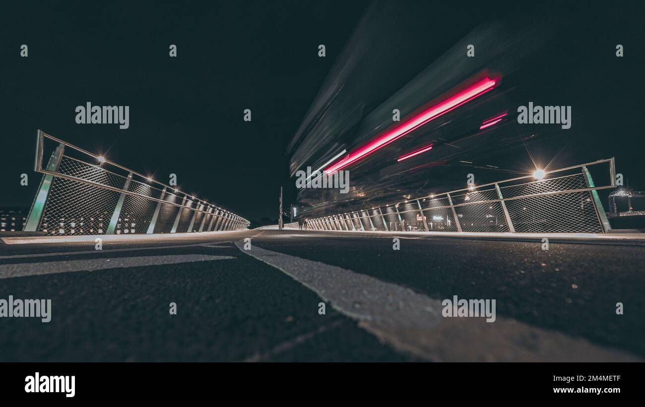 illuminated pedestrian bridge at night Stock Photo - Alamy