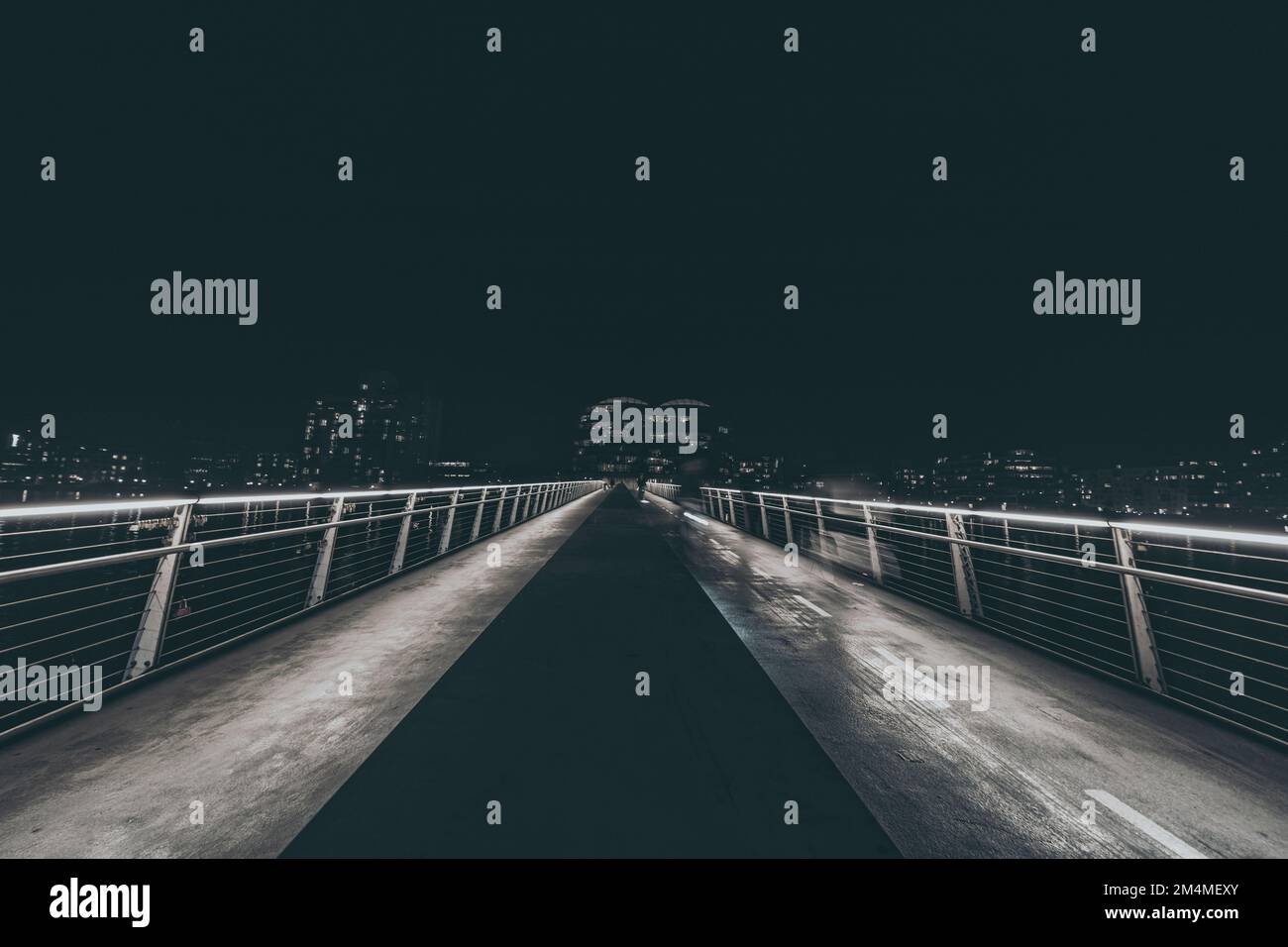 illuminated pedestrian bridge at night Stock Photo - Alamy