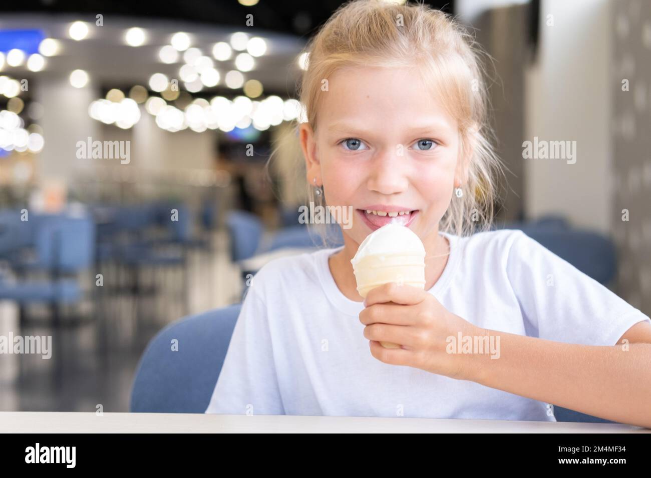 Little girl is eating ice cream hi-res stock photography and images - Alamy
