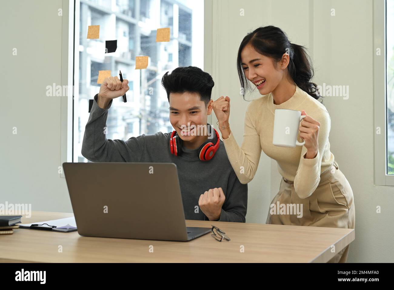 Creative people celebrating corporate project success, complete finish ...