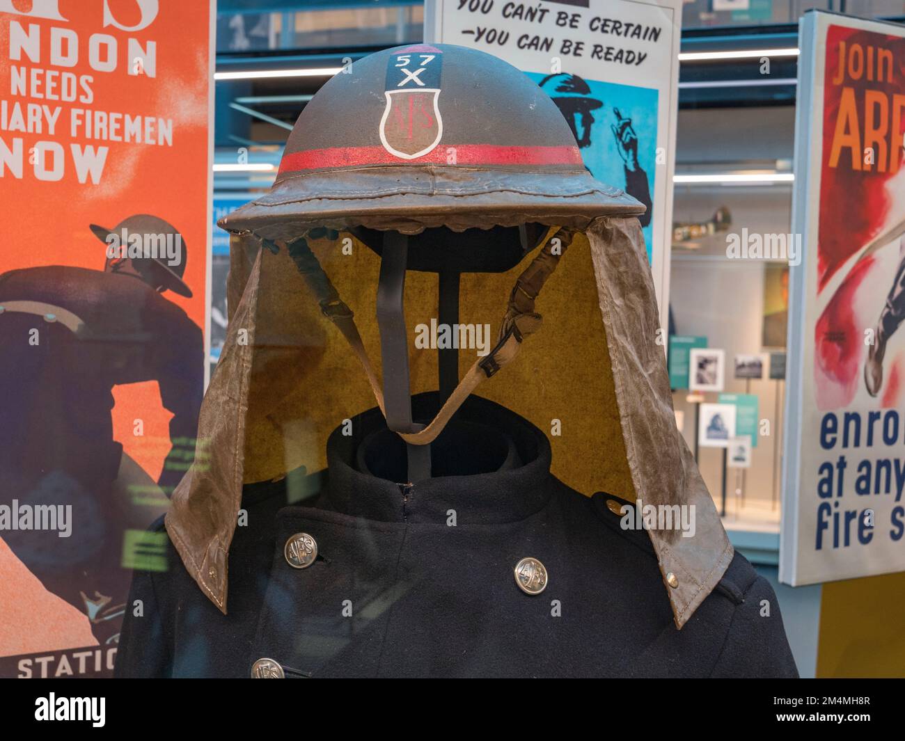 A volunteer Auxilliary Fire Service (AFS) helmet with neck protector ...