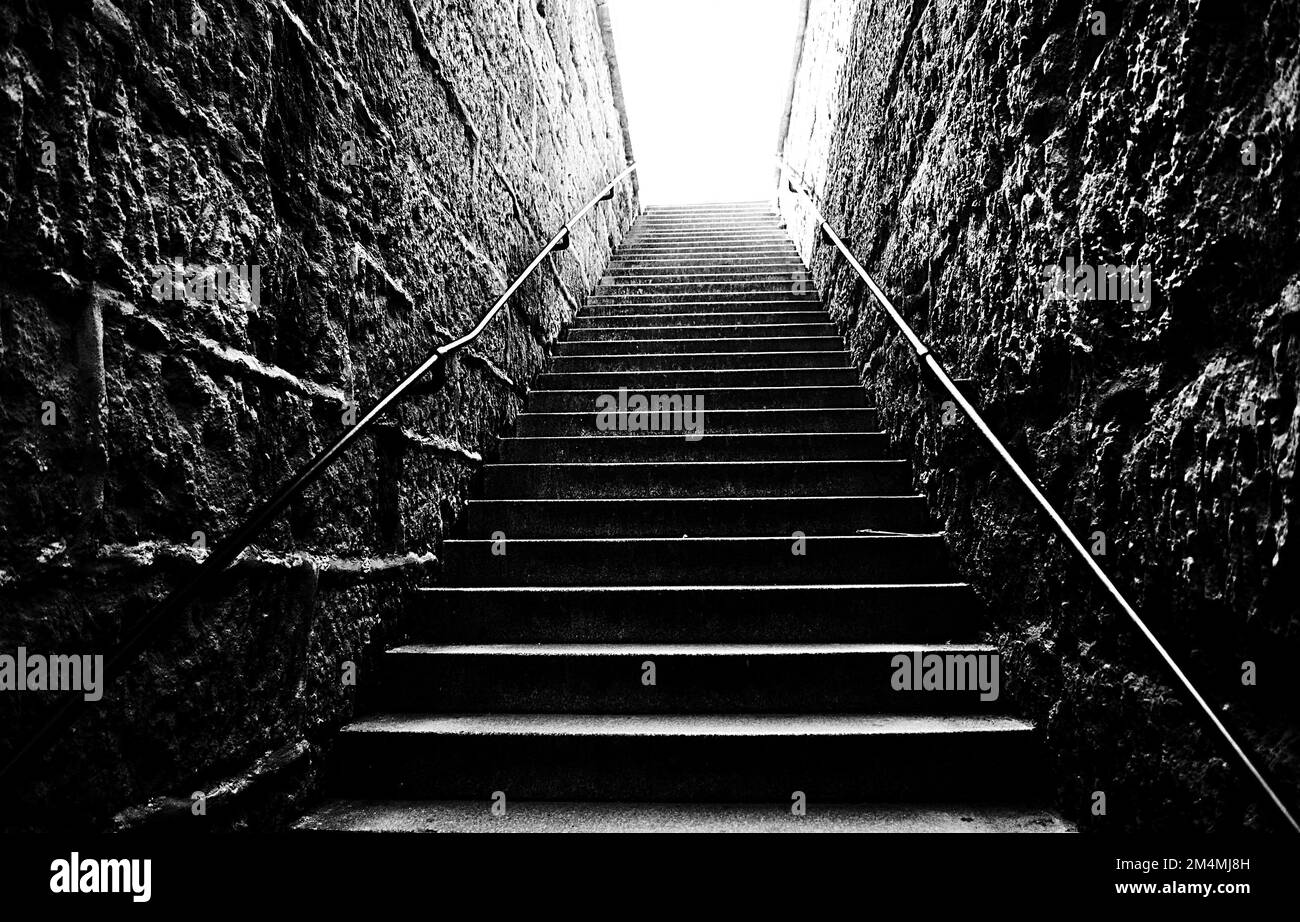 Stairs leading up to the light. Light at End of Tunnel. Black and white photo taken in Paris ...