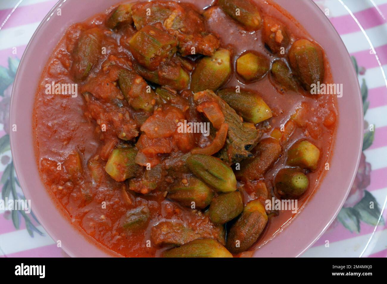Okra cooked with beef meat pieces and tomato sauce, Bamia, bamya or ...