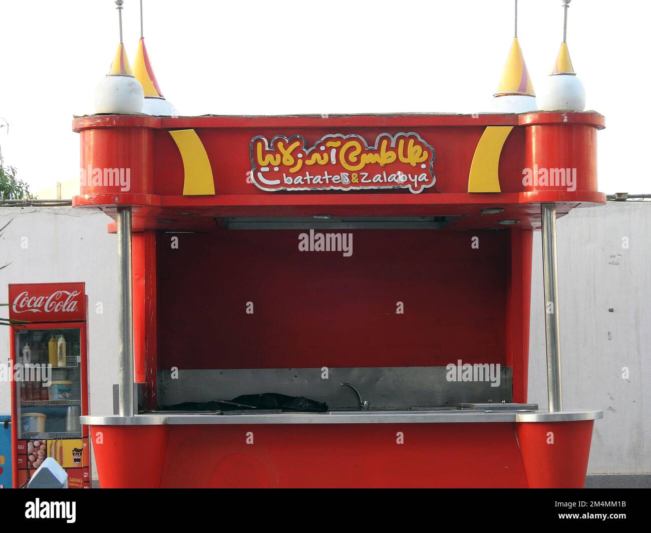 Cairo, Egypt, December 10 2022: Batates and Zalabya or potatoes and ...