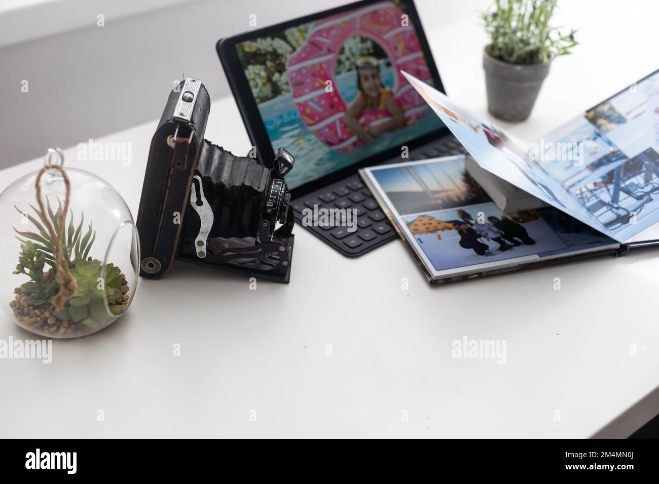tablet, photo camera on an office desk Stock Photo - Alamy