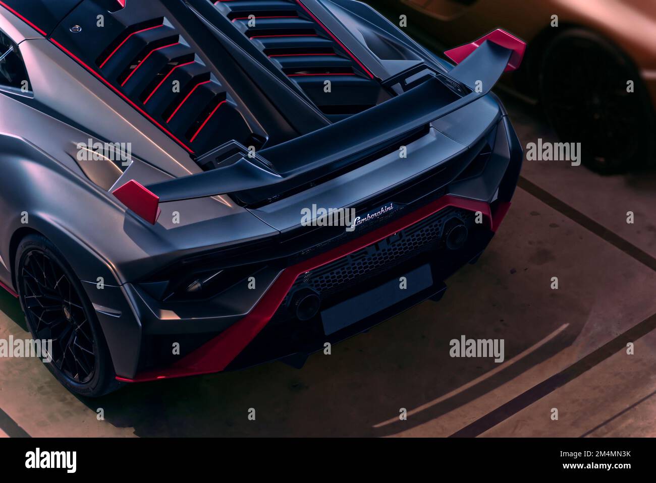 A high angle shot of a luxury Lamborghini Huracan STO car in a parking ...