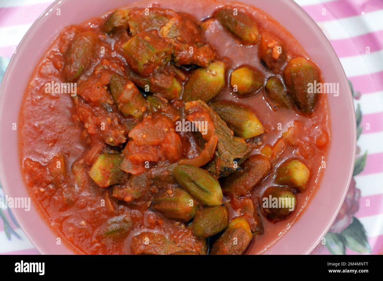 African lady cooking stew hi-res stock photography and images - Alamy