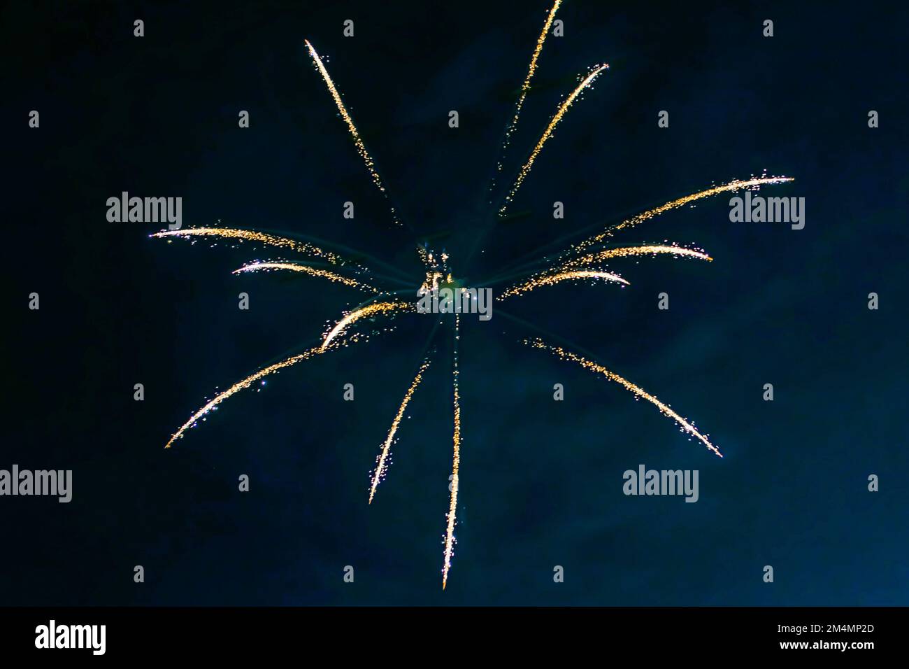 An explosion of bright single fireworks, against the background of the ...