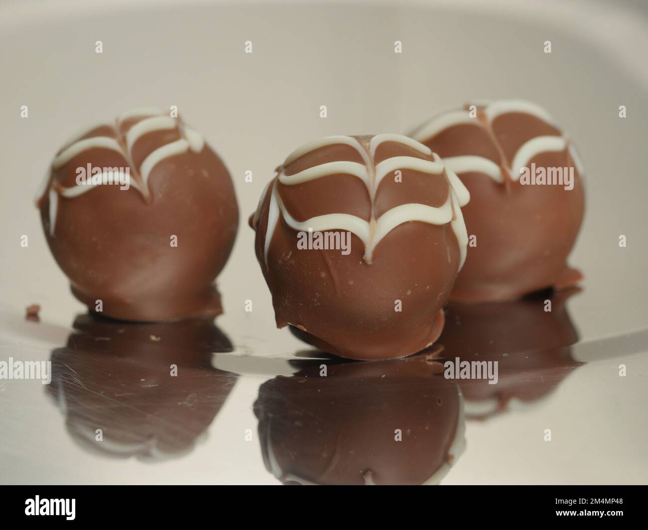 handmade pralines from chocolate on display Stock Photo - Alamy