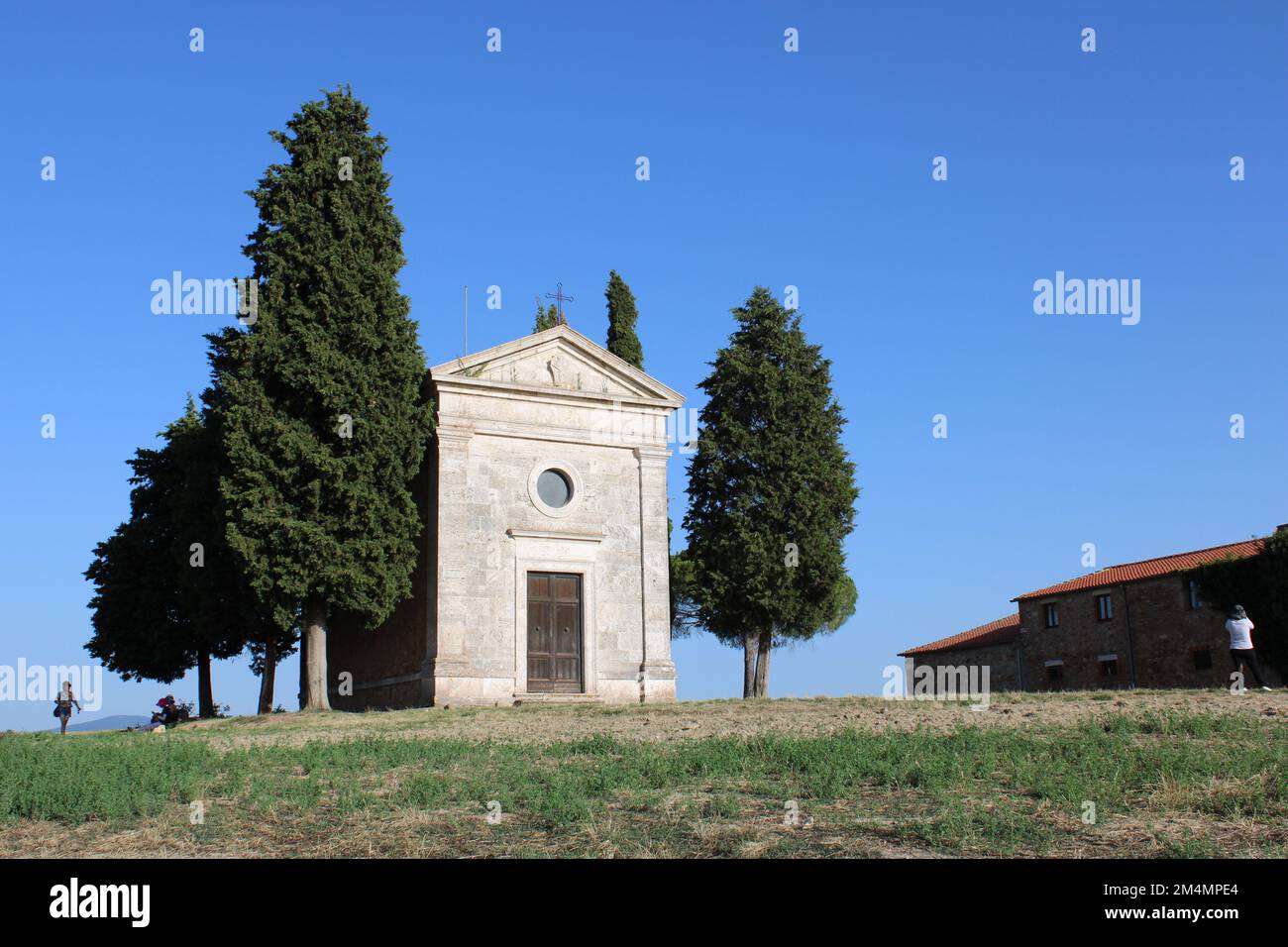 A small church on a hill surrounded by trees Stock Photo - Alamy