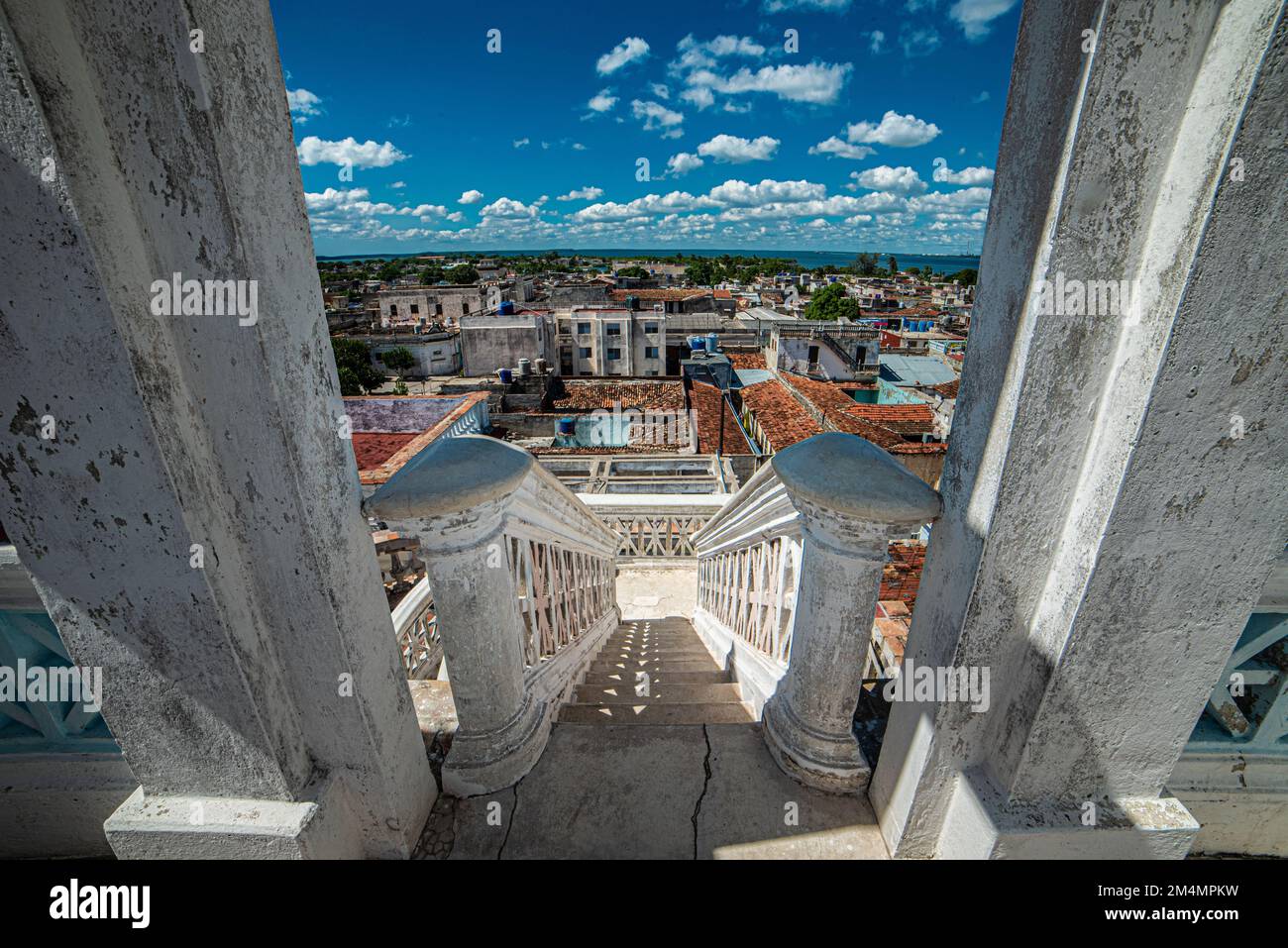 A high angle shot of white stairs leading down to Cienfuegos city in ...