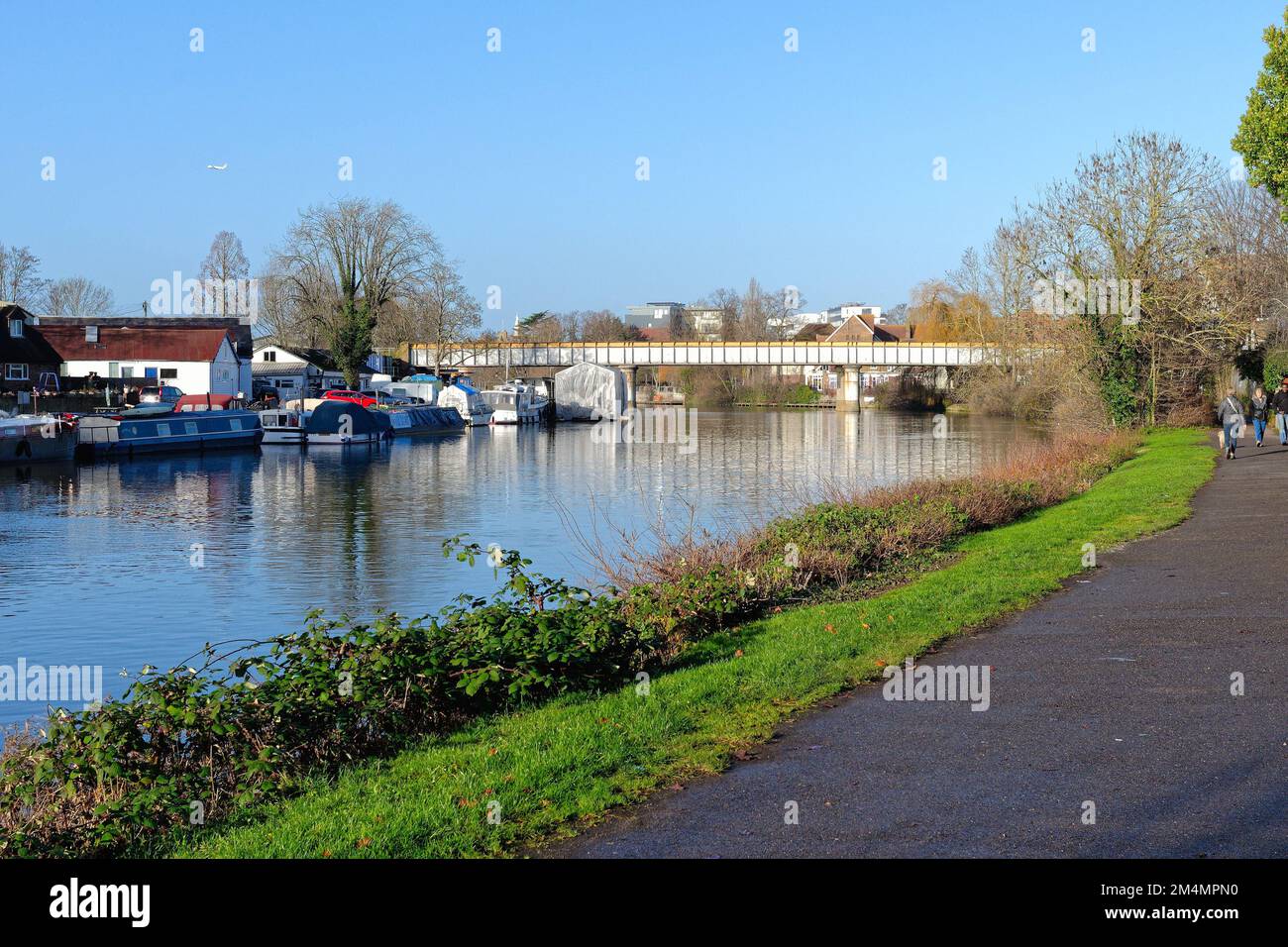 The railway bridge over the River Thames at Staines, on a sunny winters ...