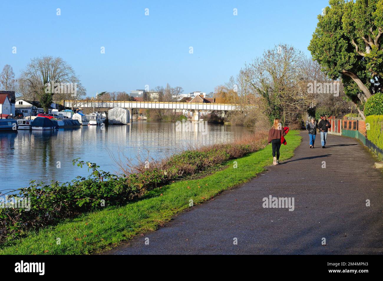 The railway bridge over the River Thames at Staines, on a sunny winters ...