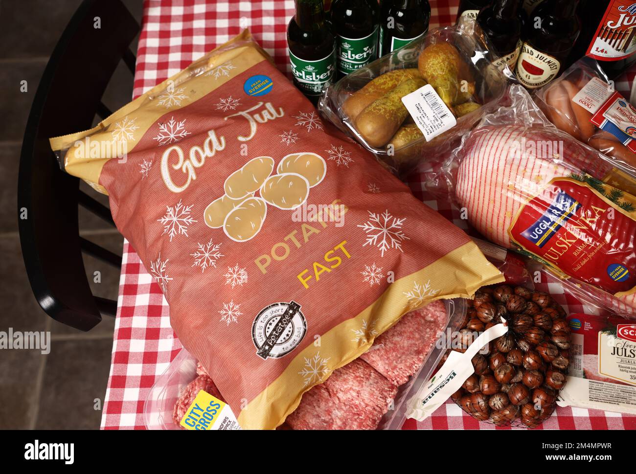 Christmas food from a grocery store, photographed on a kitchen table in ...