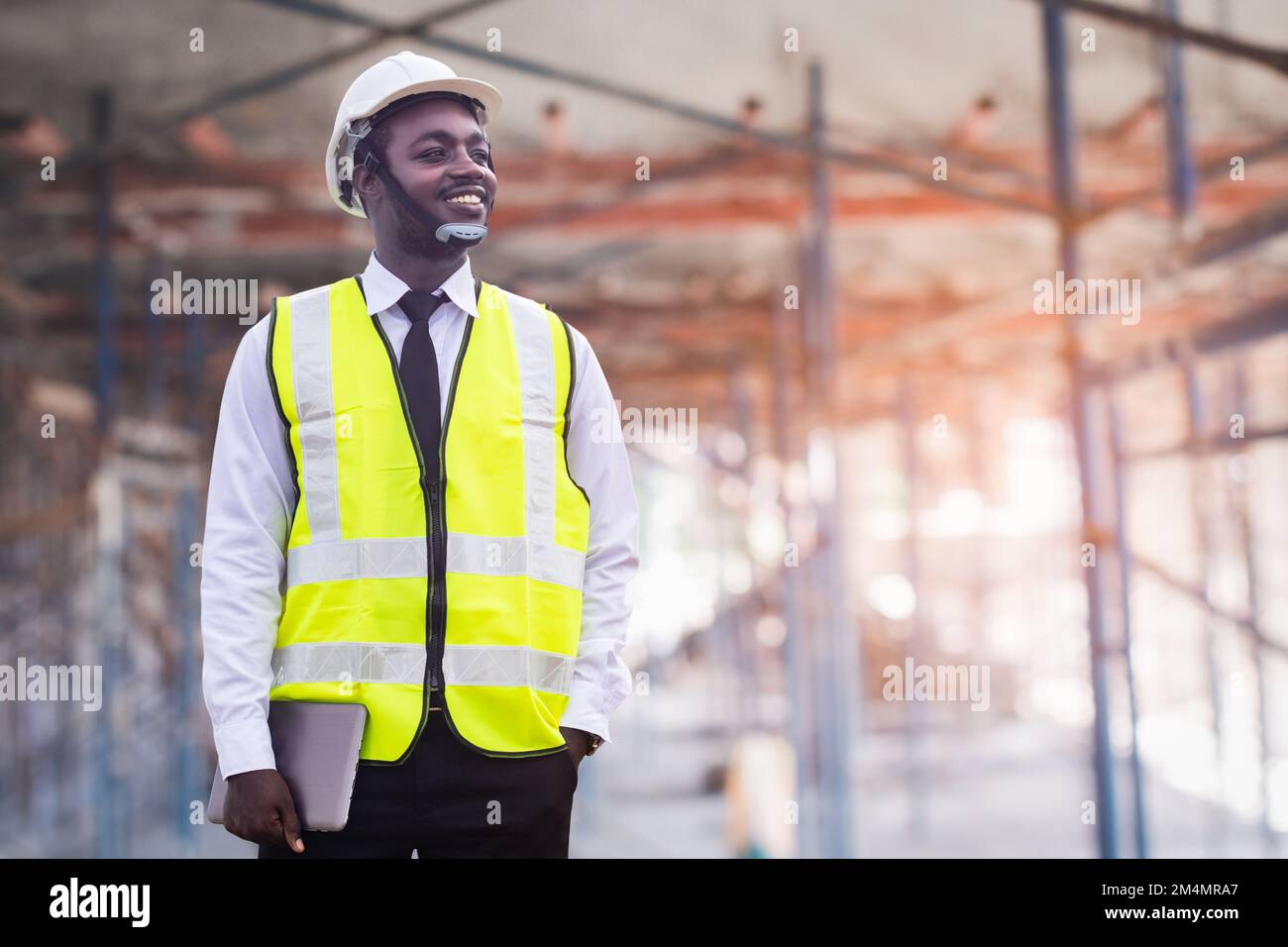 African architects engineer man with tablet work together in the inside ...