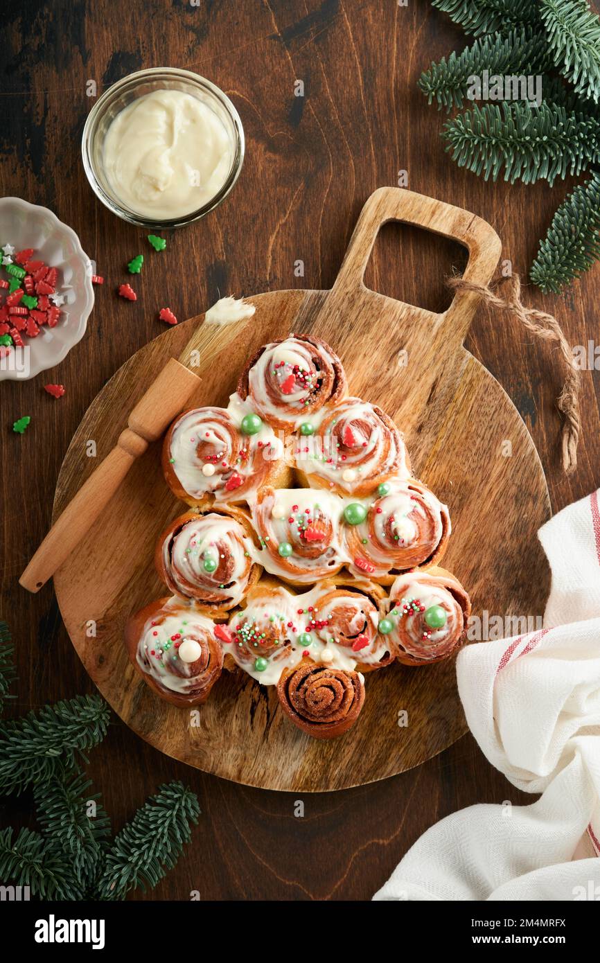 Christmas tree shape cinnamon rolls or cinnabon buns with cinnamon and ...
