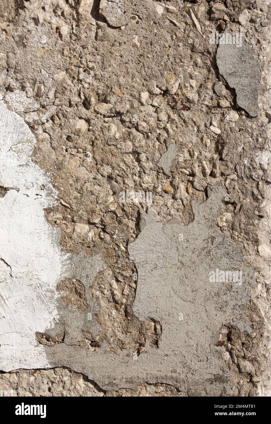 Abstract background of an vintage battered concrete wall. Vertical ...