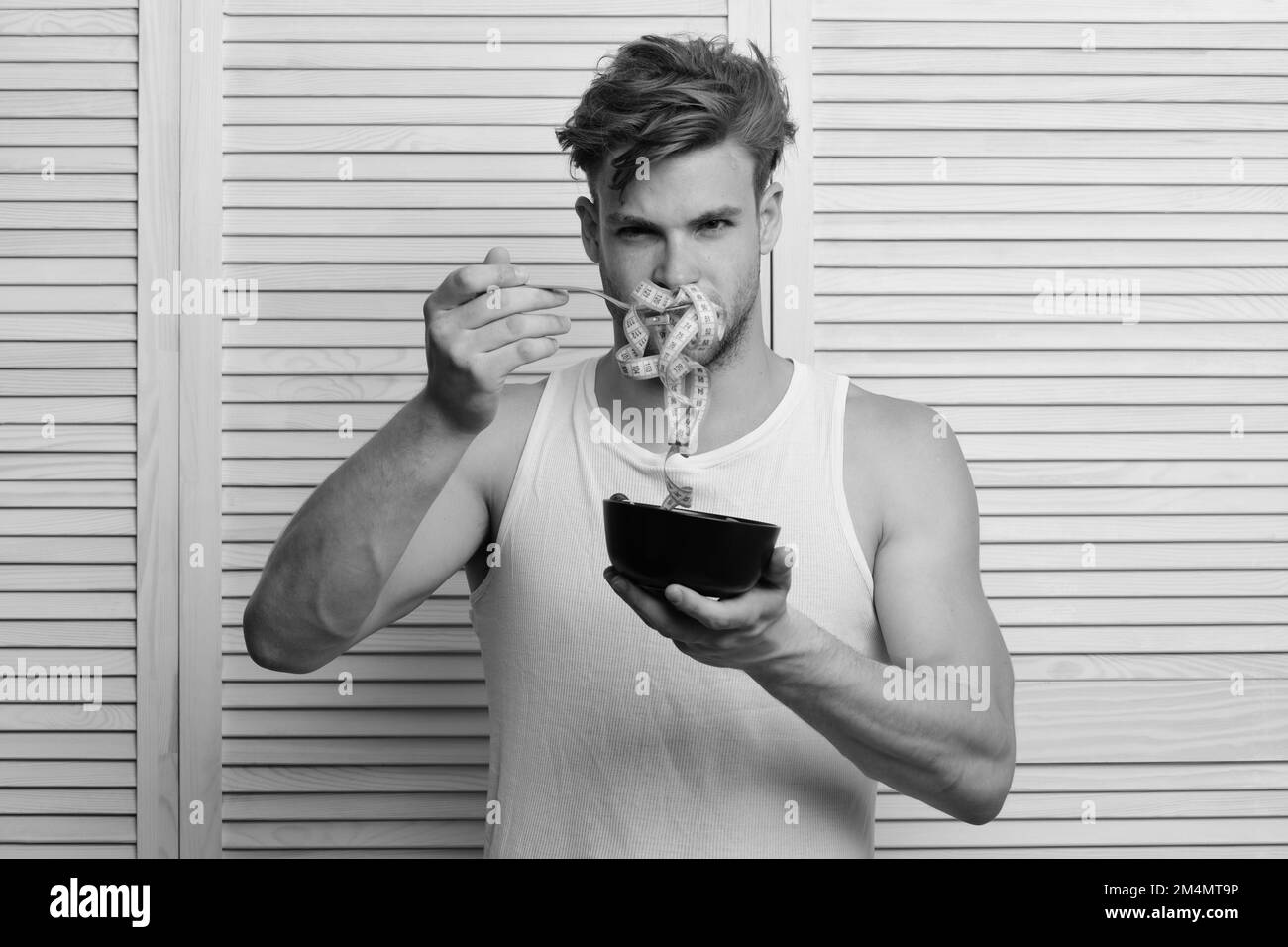 Man serious face holds Black and White Stock Photos & Images - Alamy