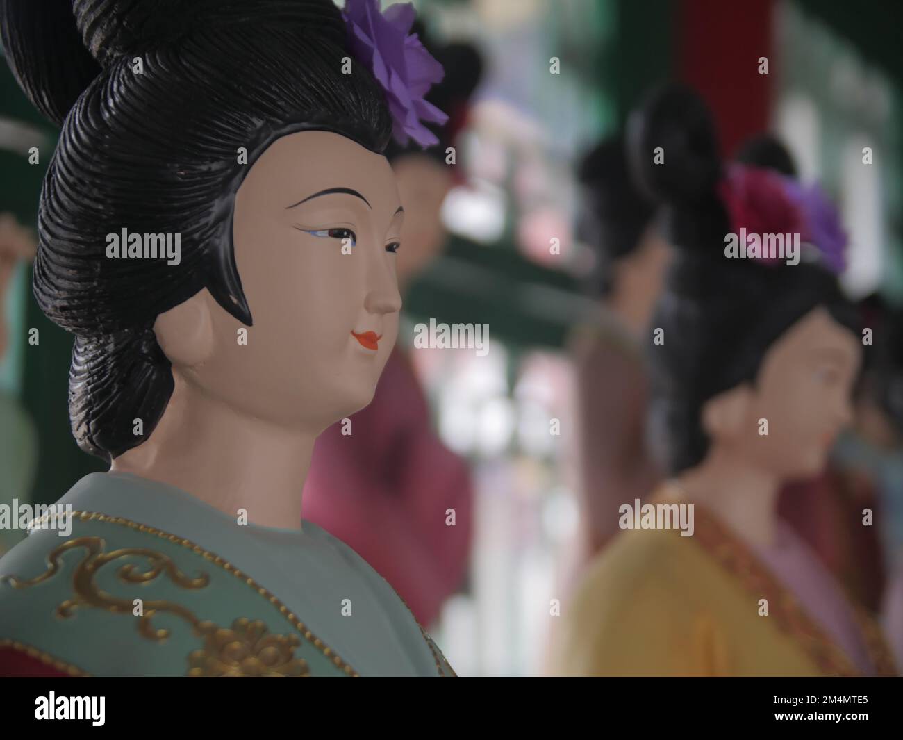 A closeup shot of a bunch of traditional Chinese lady sculptures Stock ...